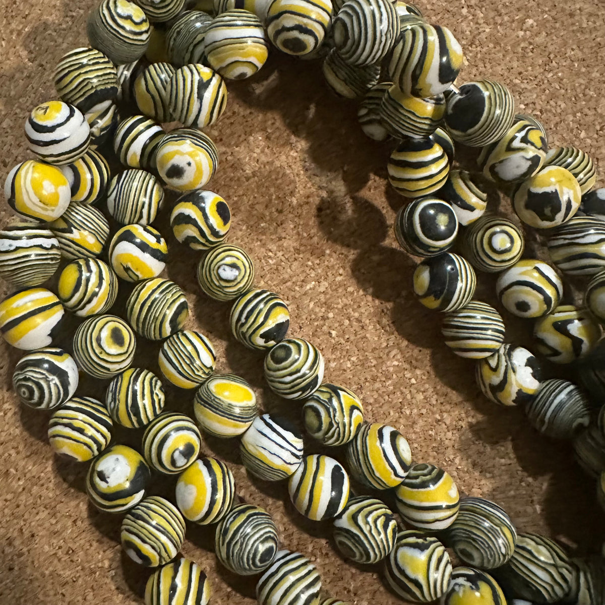 Yellow and black swirl beads. – Royalty and Beads