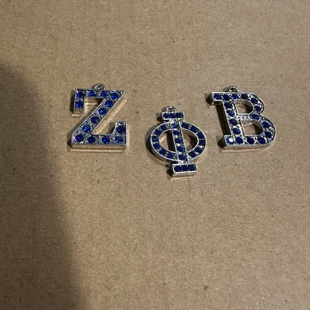 Blue Zeta Phi Beta letters. – Royalty and Beads
