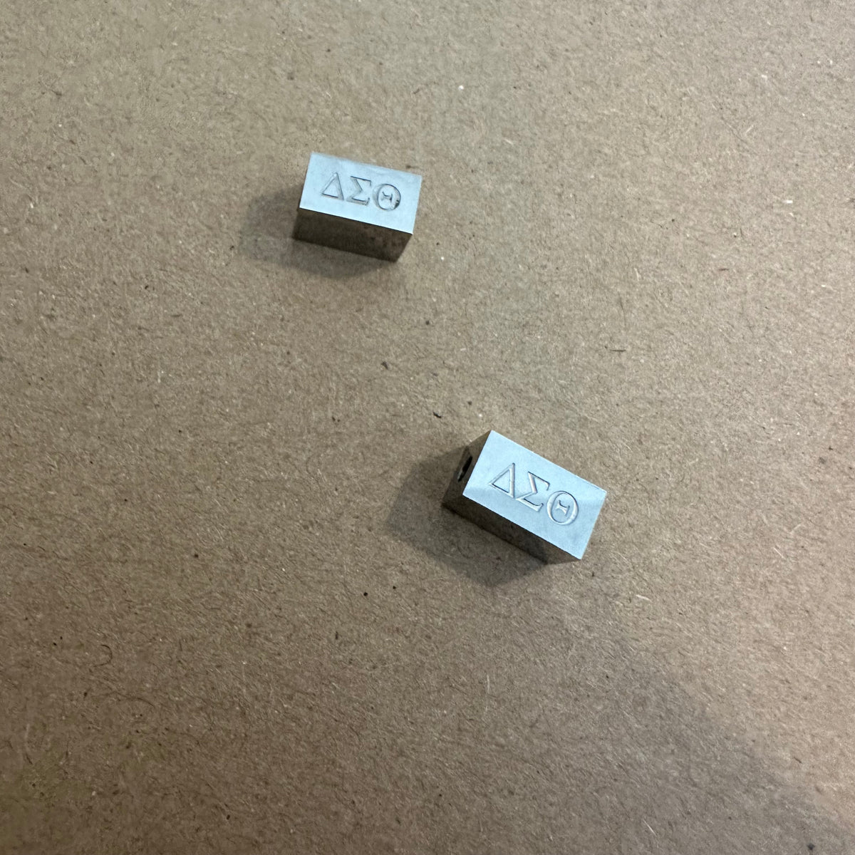 Small Delta block charms. – Royalty and Beads