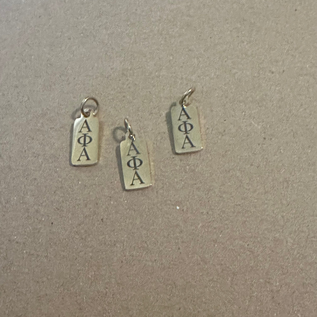 Alpha Phi Alpha tag charm. – Royalty and Beads